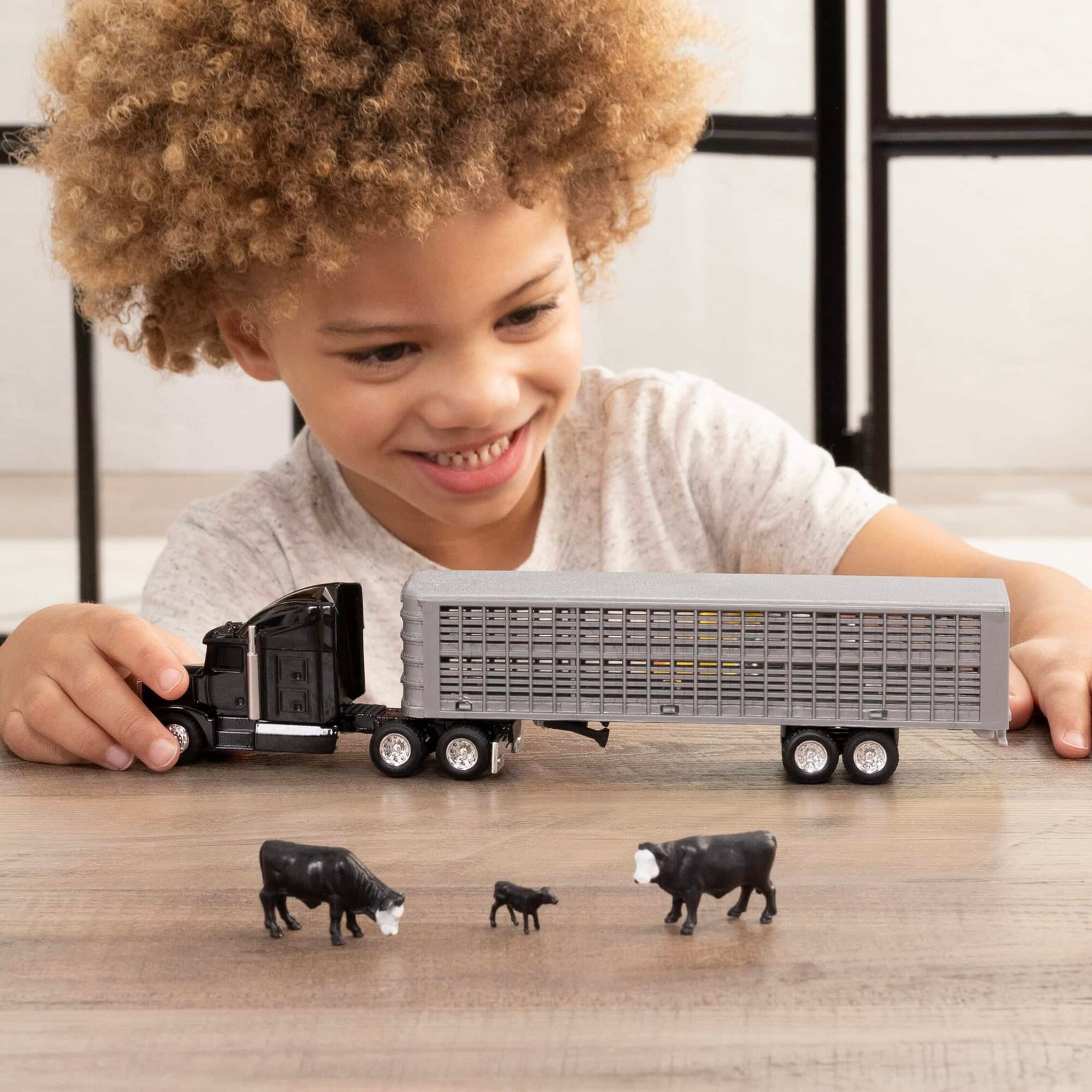 1/64 Black Semi Truck with Cattle Trailer & Cattle by ERTL — Outback Toys